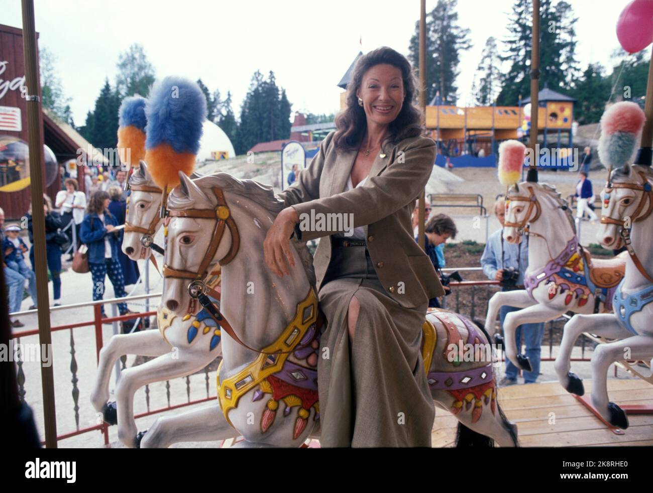 Oslo 19880601 Åse Kleveland on a carousel horse in the "Tusenfryd ...
