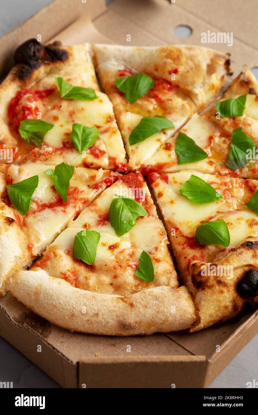 Organic Margarita Pizza with Basil and Mozarella in a Box, side view ...