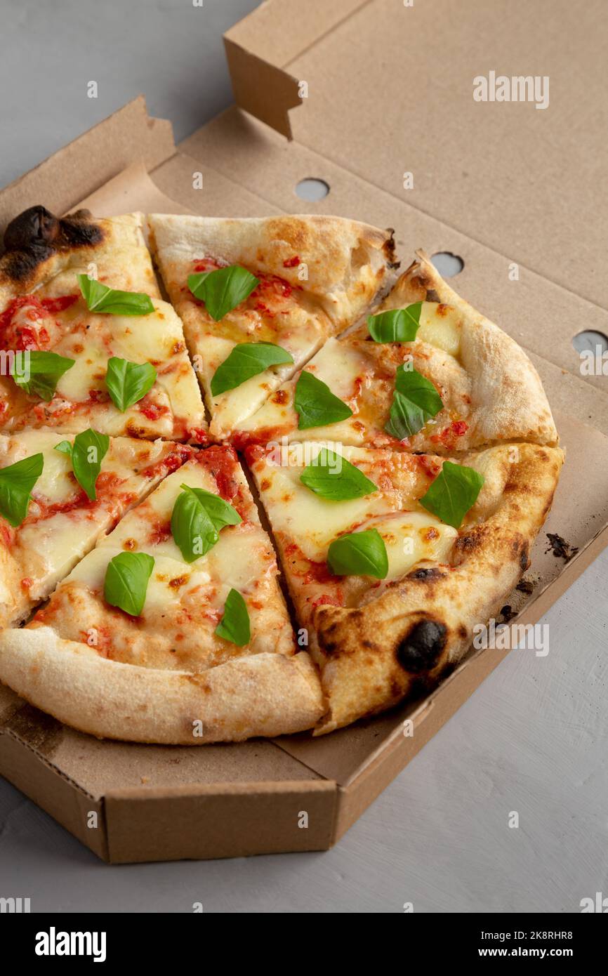 Organic Margarita Pizza with Basil and Mozarella in a Box, side view ...