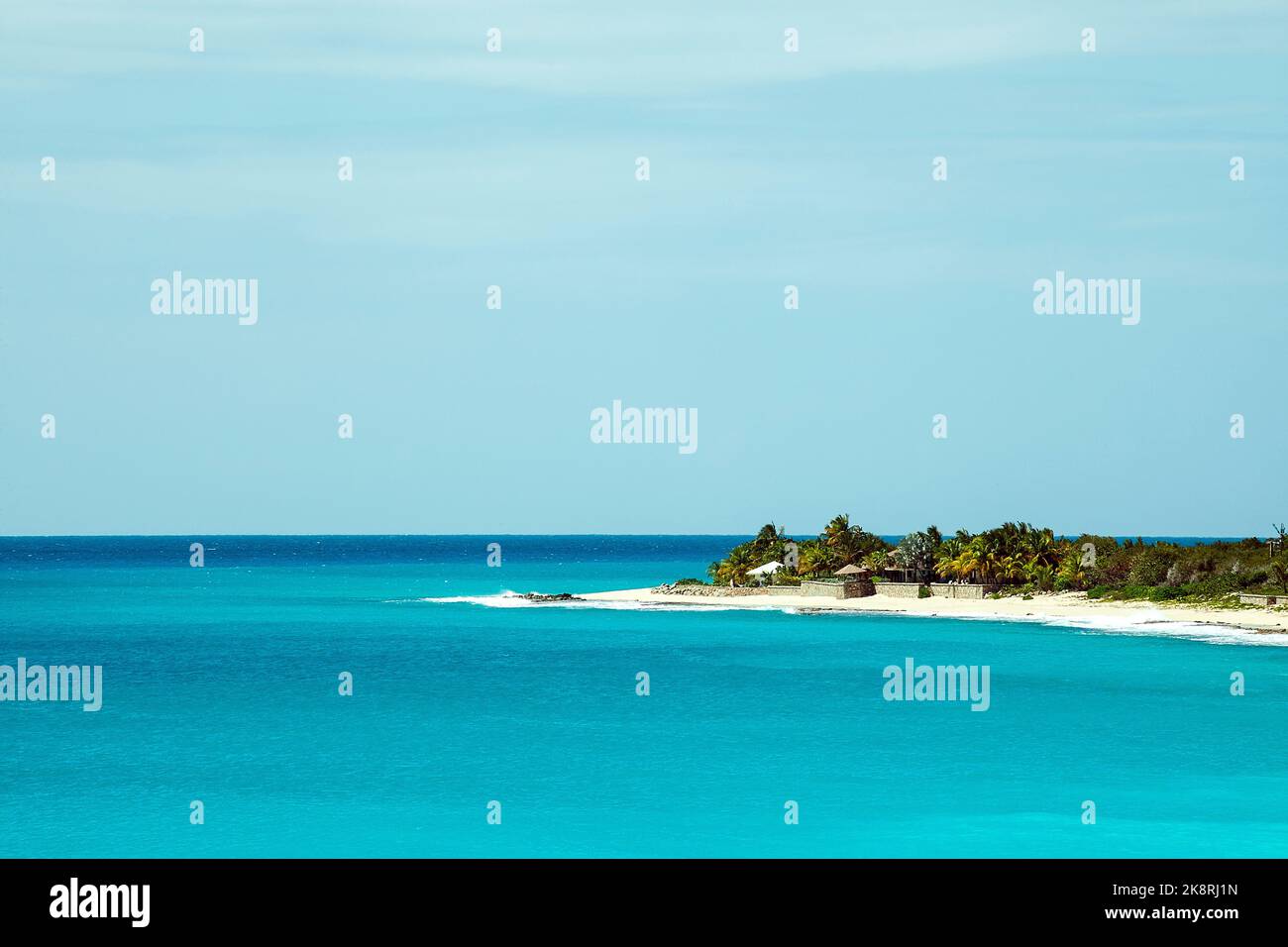 A beautiful shot of an island surrounded by an azure ocean Stock Photo ...
