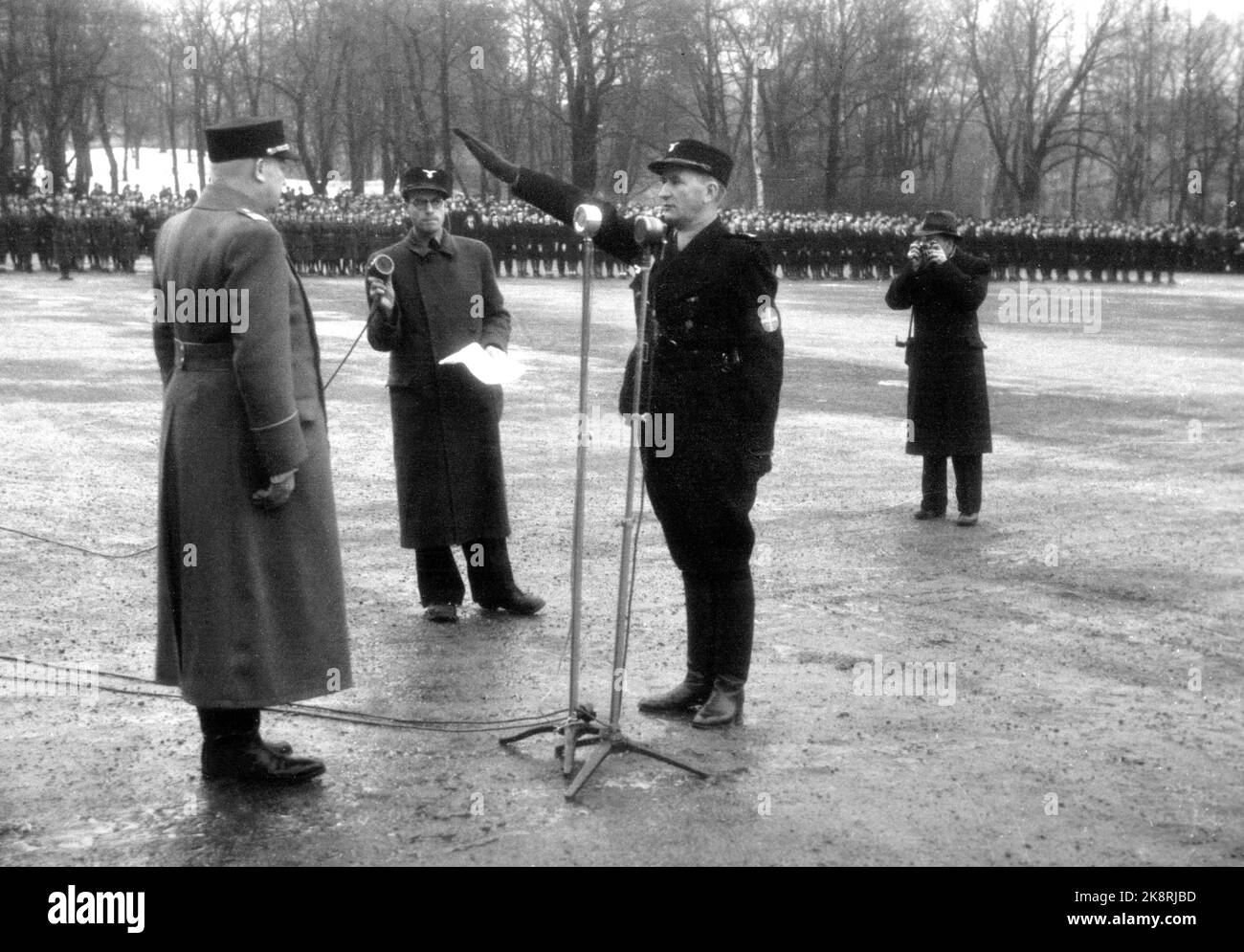 Oslo February 1943. NS leader Vidkun Quisling (long coat t.v) Parade in ...