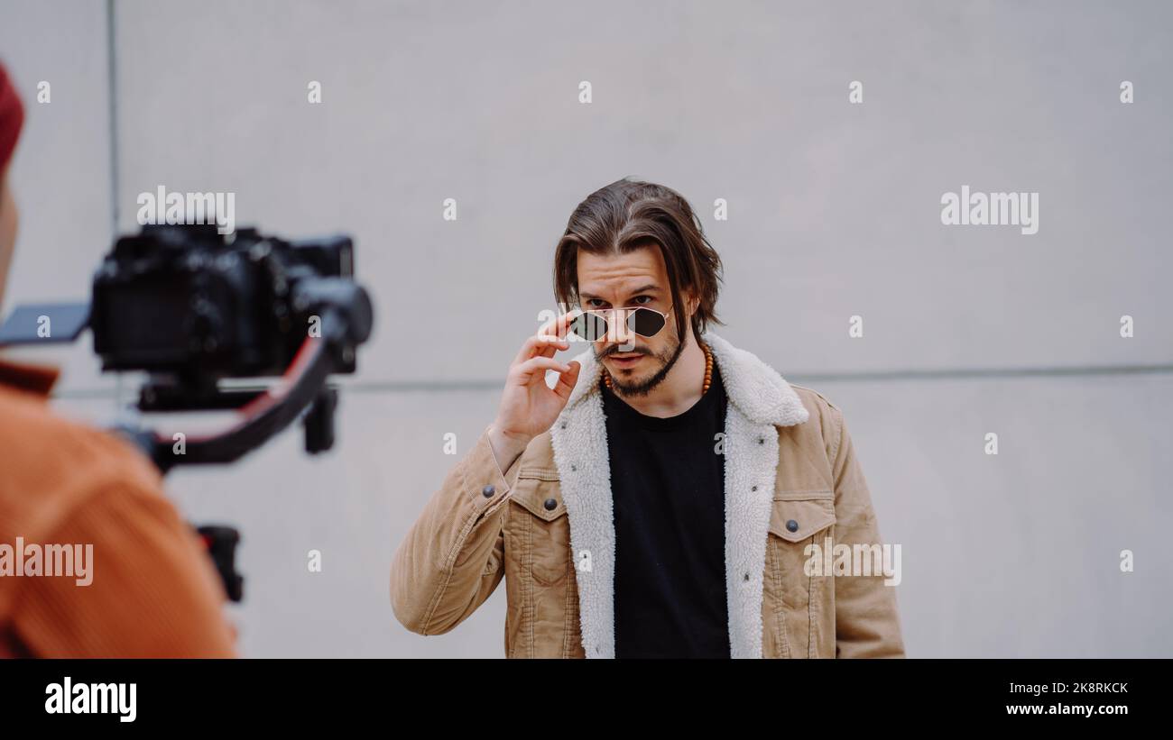 Cameraman shooting young attractive model hi-res stock photography and ...