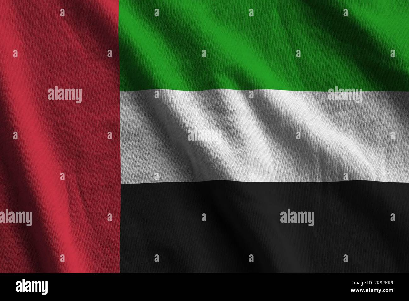 United Arab Emirates flag with big folds waving close up under the ...