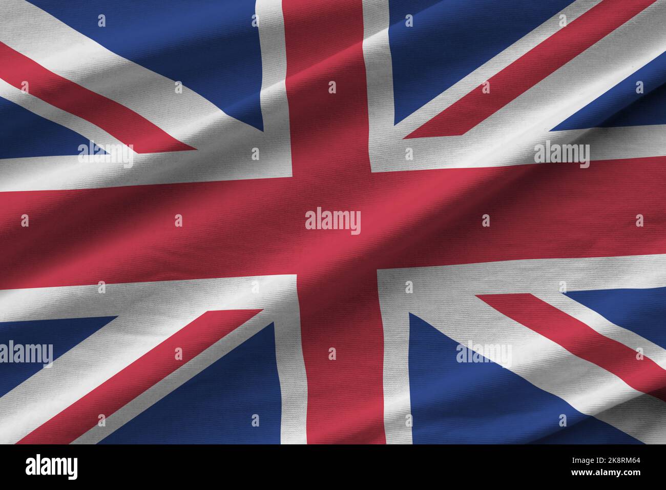 Great britain flag with big folds waving close up under the studio ...