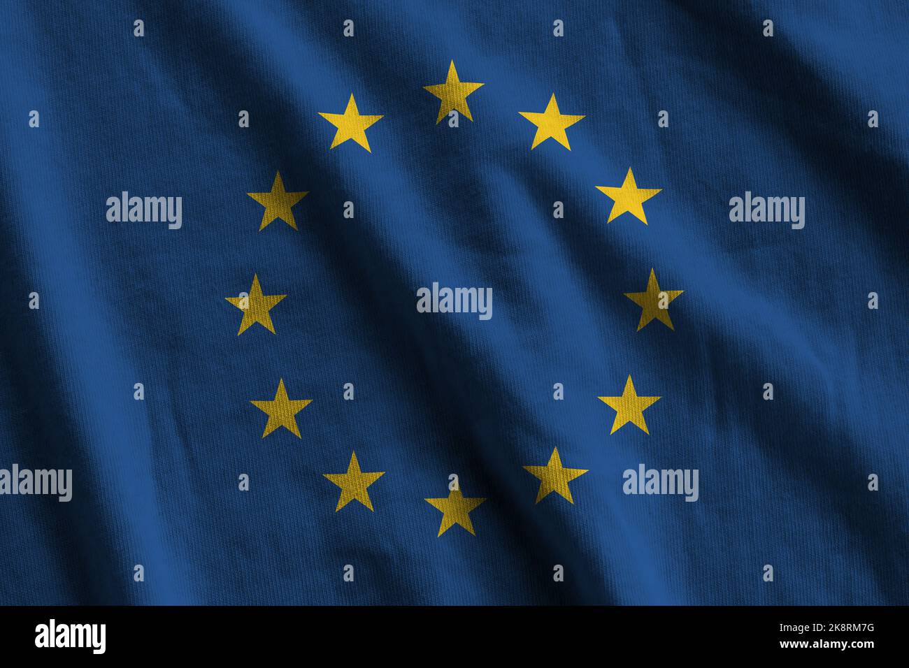European union flag with big folds waving close up under the studio ...