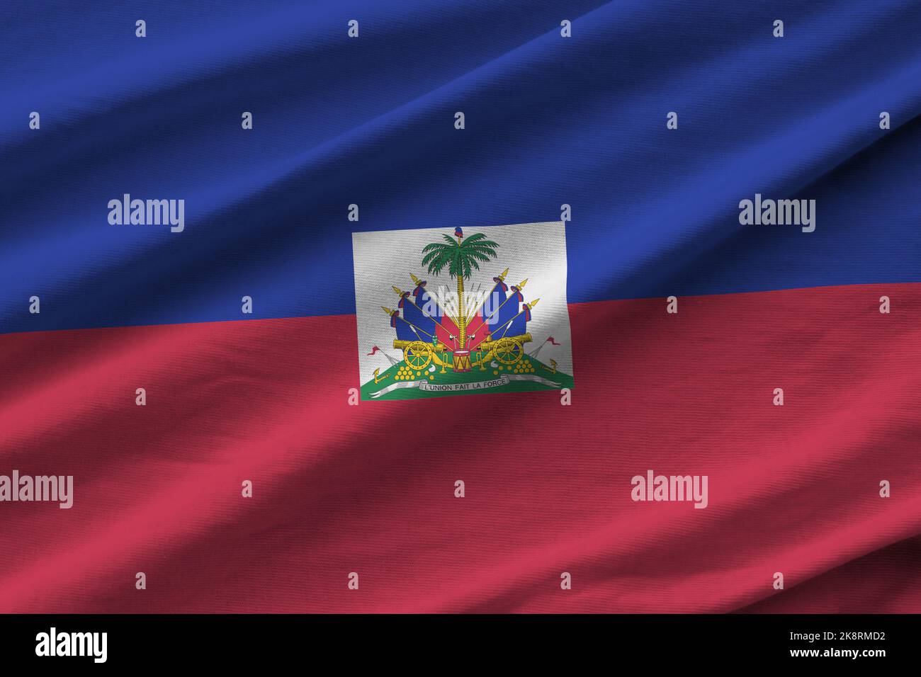 Haiti flag with big folds waving close up under the studio light ...