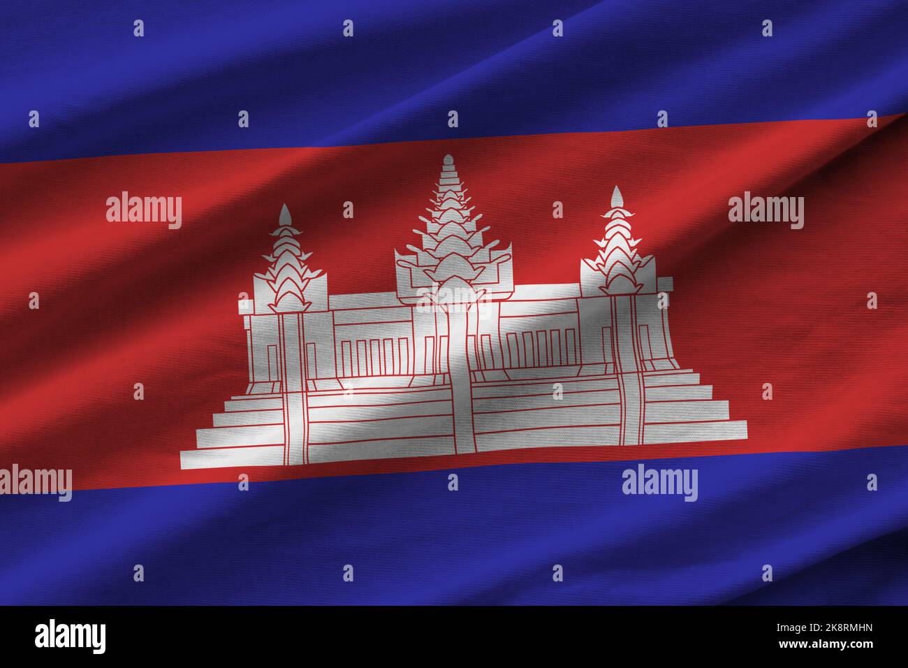 Cambodia flag with big folds waving close up under the studio light indoors. The official ...