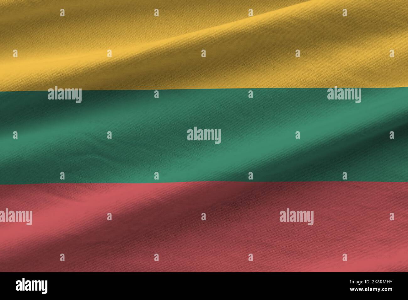 Lithuania flag with big folds waving close up under the studio light ...