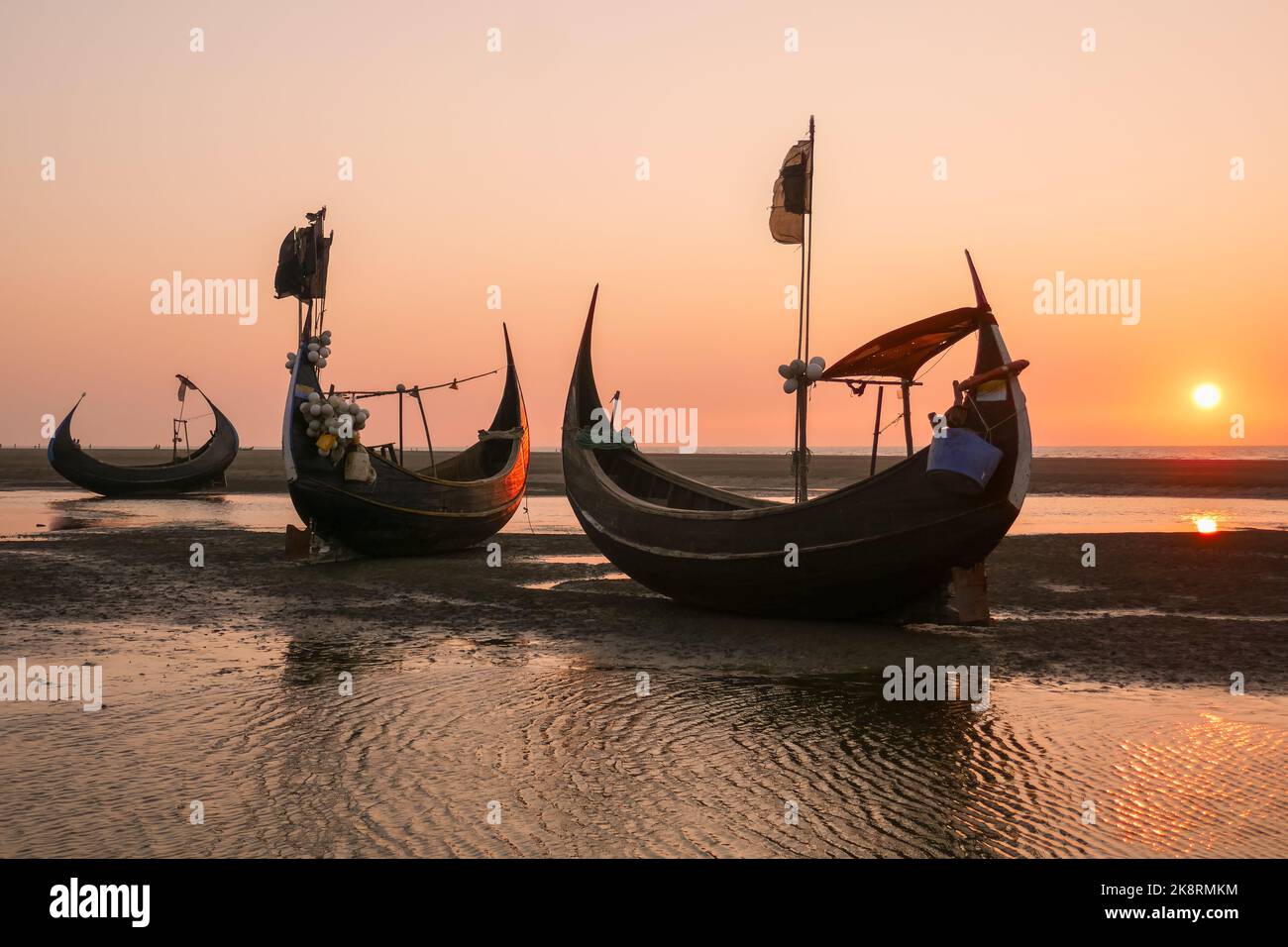 Beautiful traditional wooden fishing boats known as moon boats on beach ...