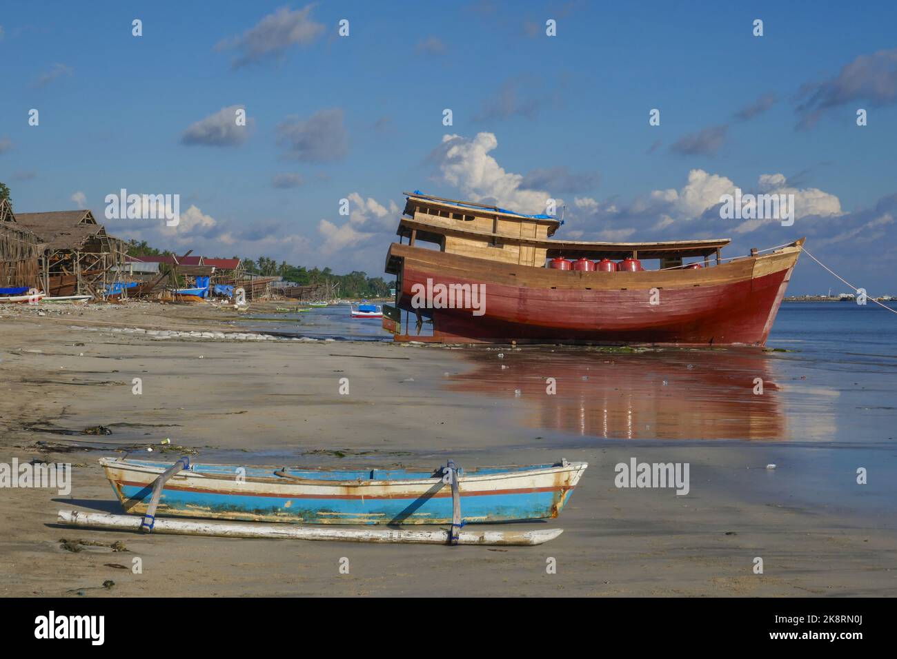 Beautiful landscape view at Bugis traditional shipyard with wooden boat ...