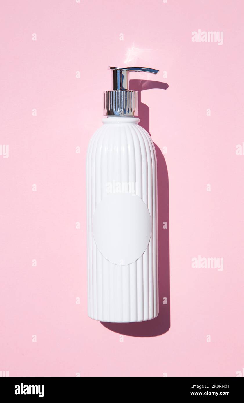Cosmetic sprayer on pink background Stock Photo - Alamy
