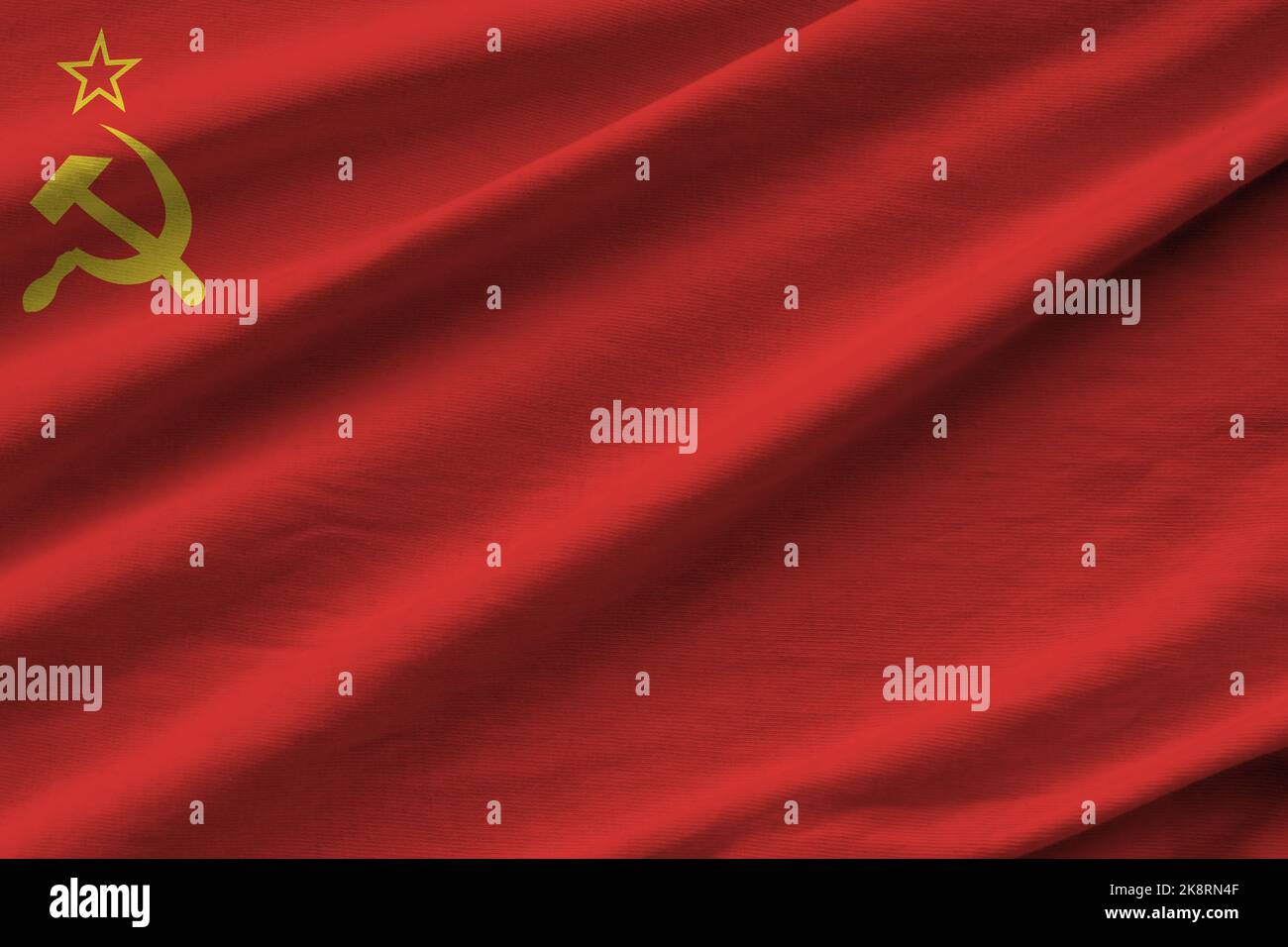 Soviet Union flag with big folds waving close up under the studio light ...