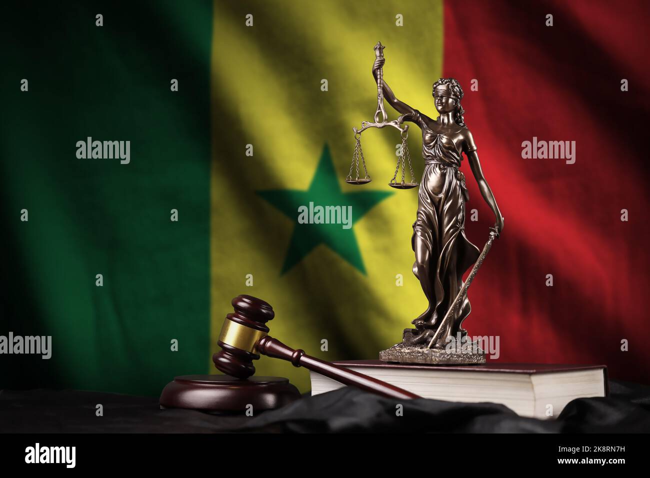 Senegal flag with statue of lady justice, constitution and judge hammer ...