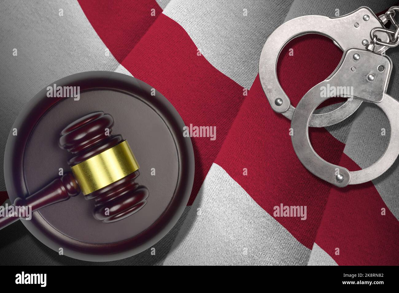 Alabama US state flag with judge mallet and handcuffs in dark room ...