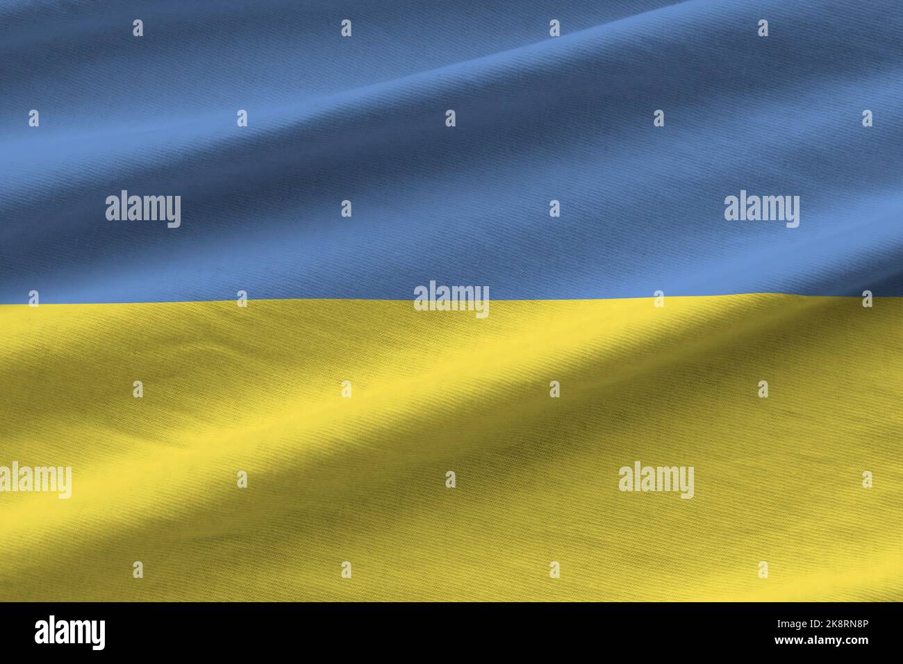 Ukraine flag with big folds waving close up under the studio light ...
