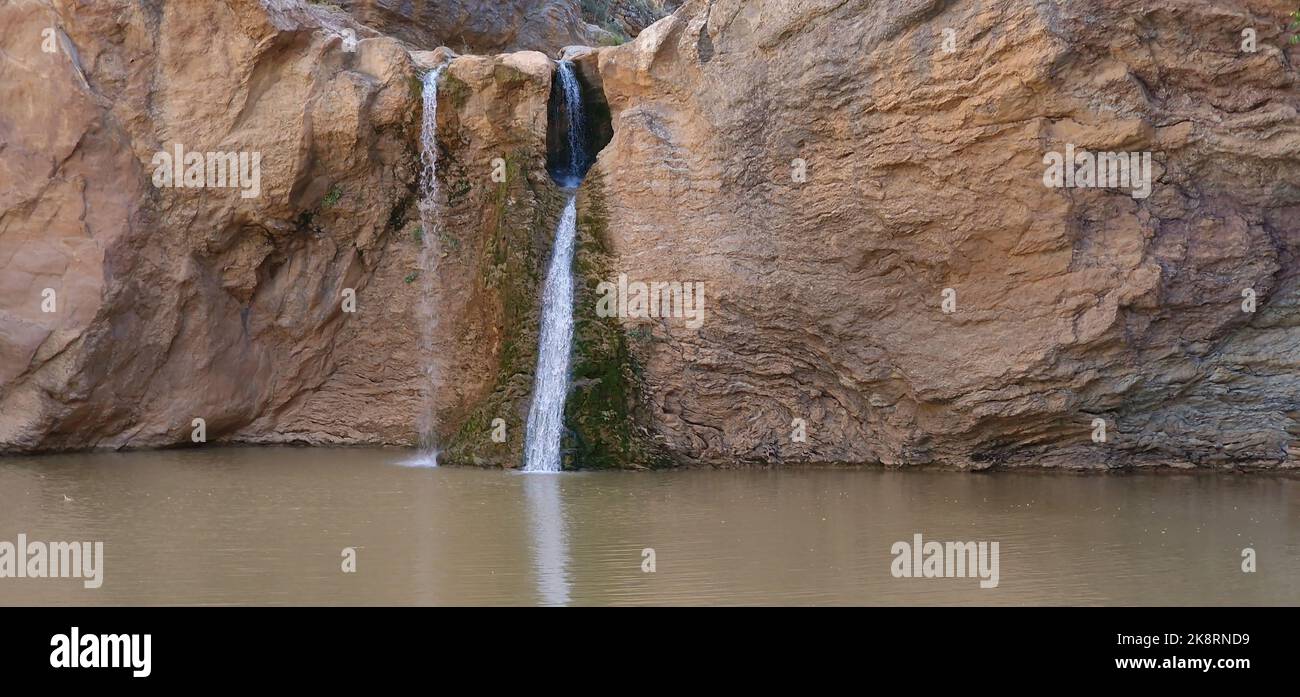 A scenic waterfall in the mountain oasis and canyon of Tamerza in ...