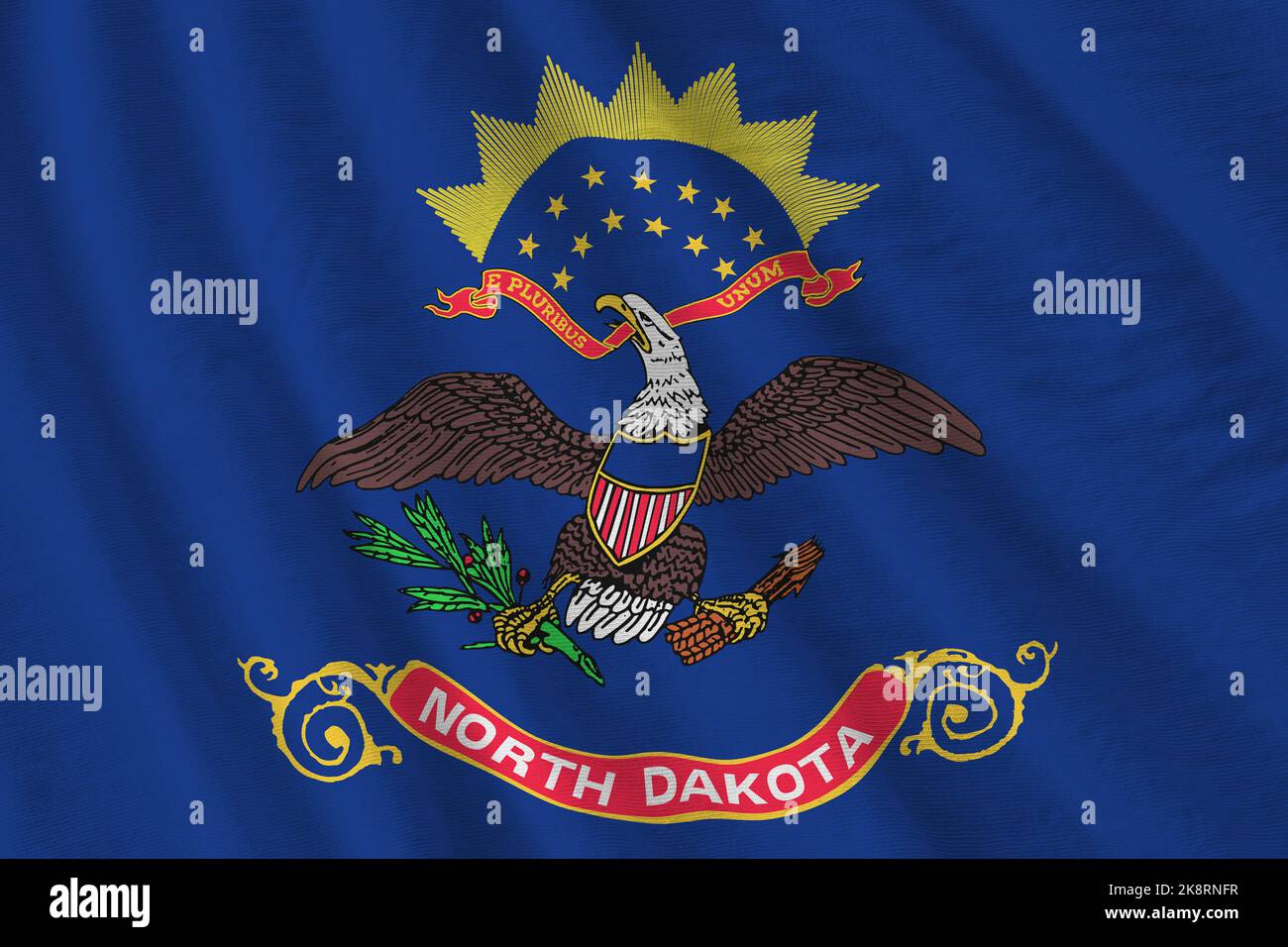 North Dakota US state flag with big folds waving close up under the ...