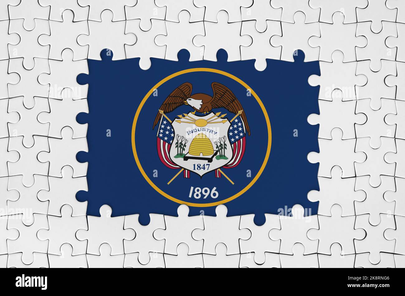 Utah US state flag in frame of white puzzle pieces with missing central ...