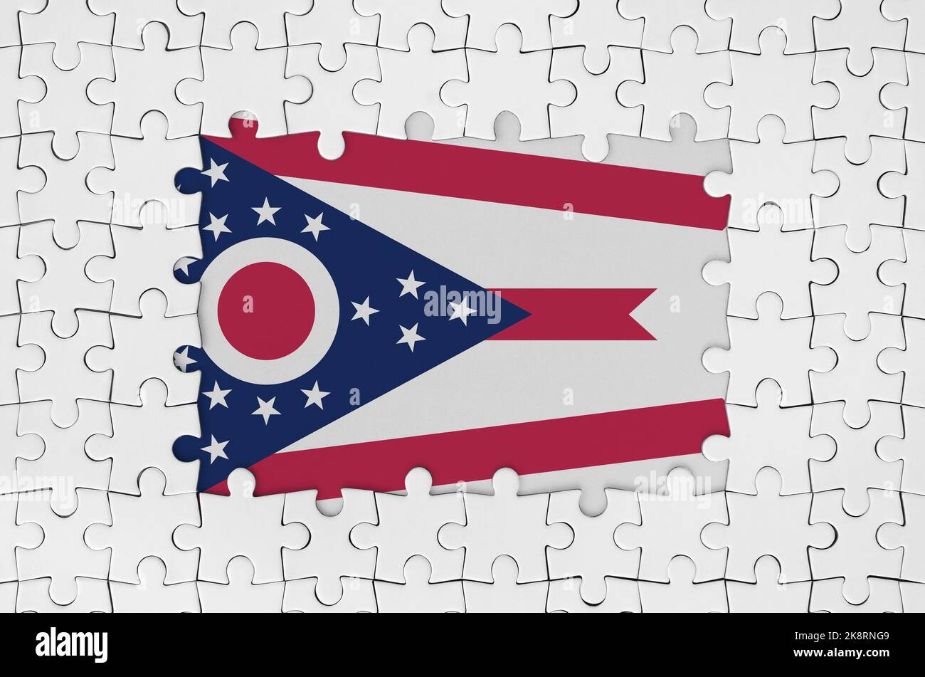 Ohio US state flag in frame of white puzzle pieces with missing central ...