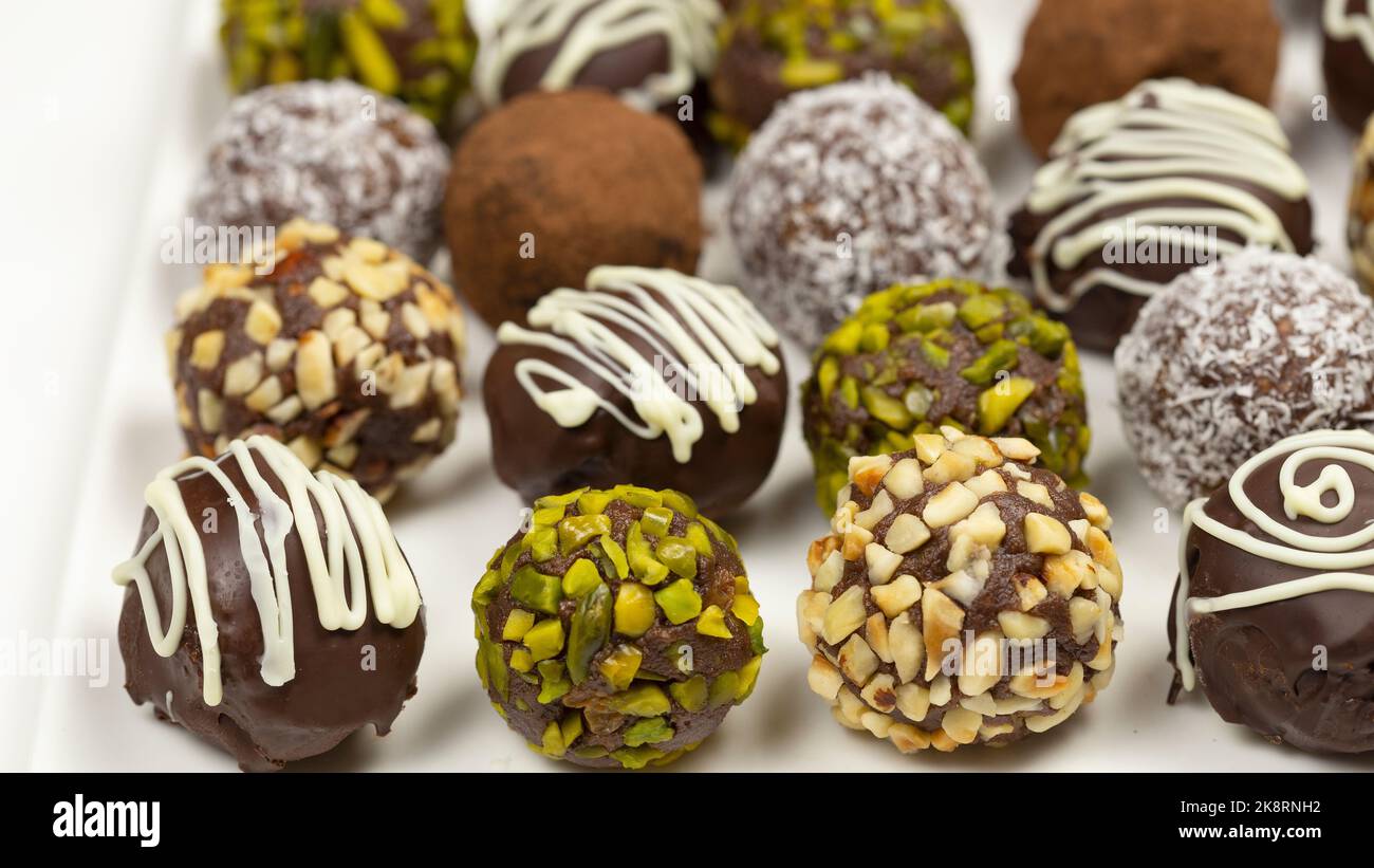 Dark and white chocolate nut truffles Stock Photo - Alamy