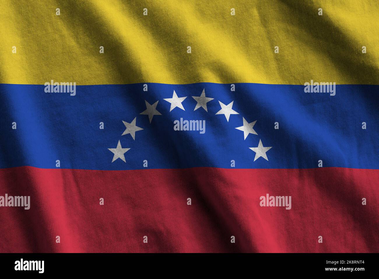 Venezuela flag with big folds waving close up under the studio light ...