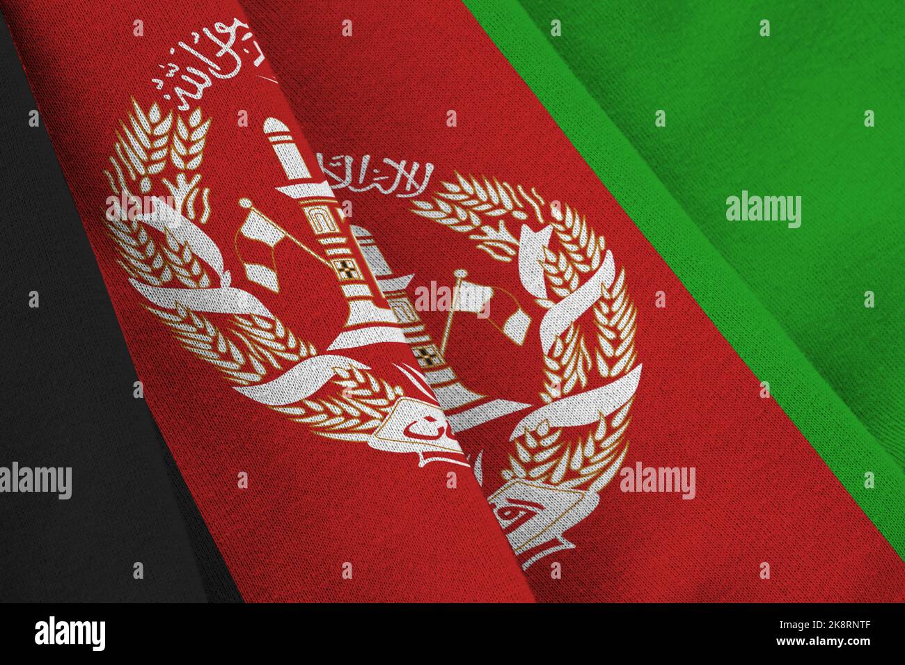 Afghanistan flag with big folds waving close up under the studio light ...