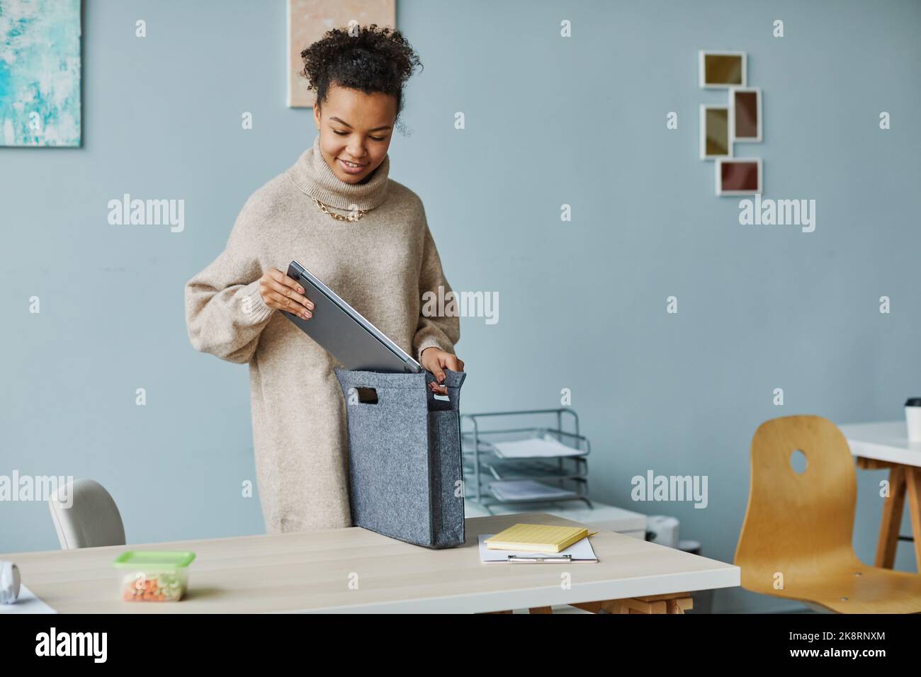 African young girl preparing for work at her workplace at office Stock ...
