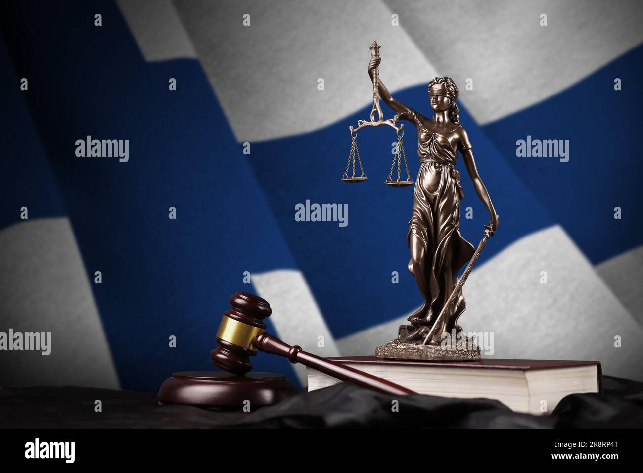 Finland flag with statue of lady justice, constitution and judge hammer ...