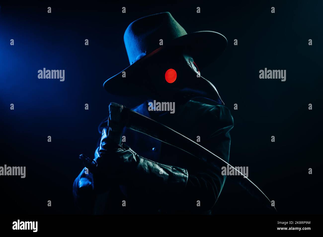 A plague doctor with sharp scythe on black smoke background - epidemic ...