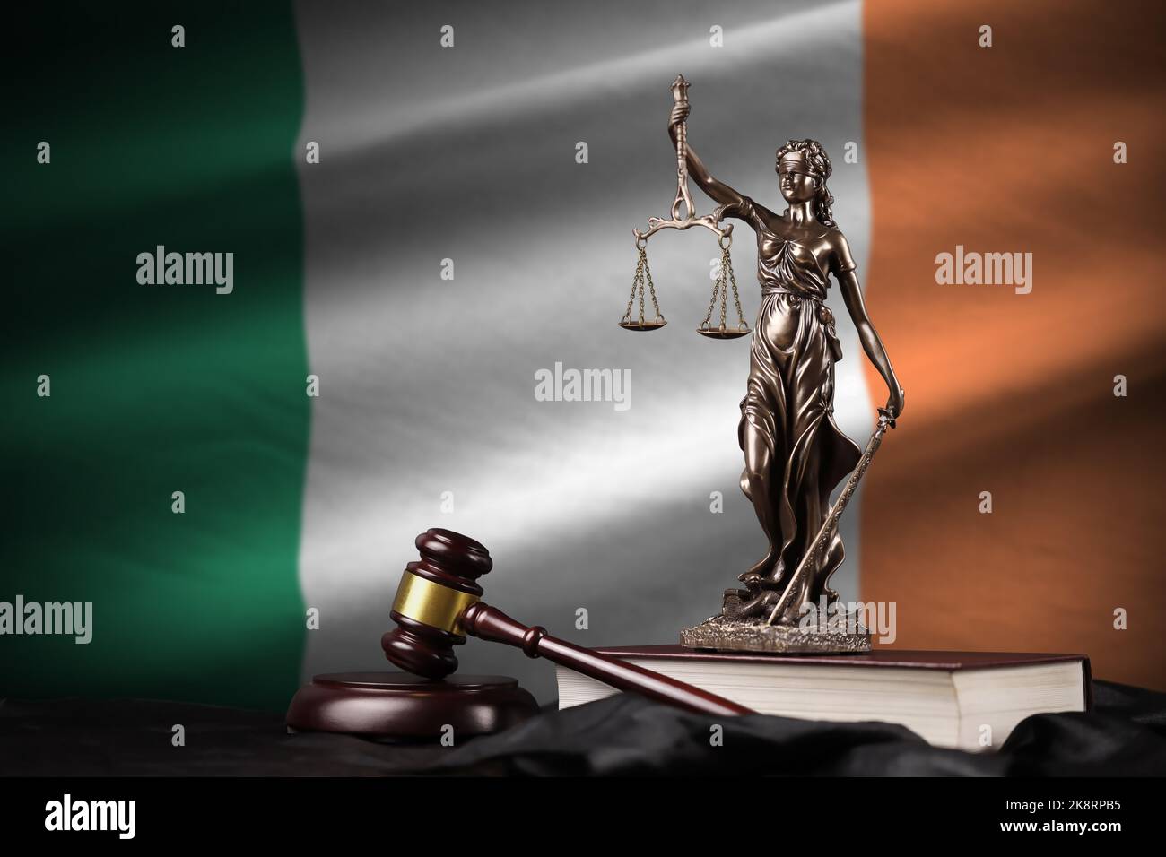 Ireland flag with statue of lady justice, constitution and judge hammer ...