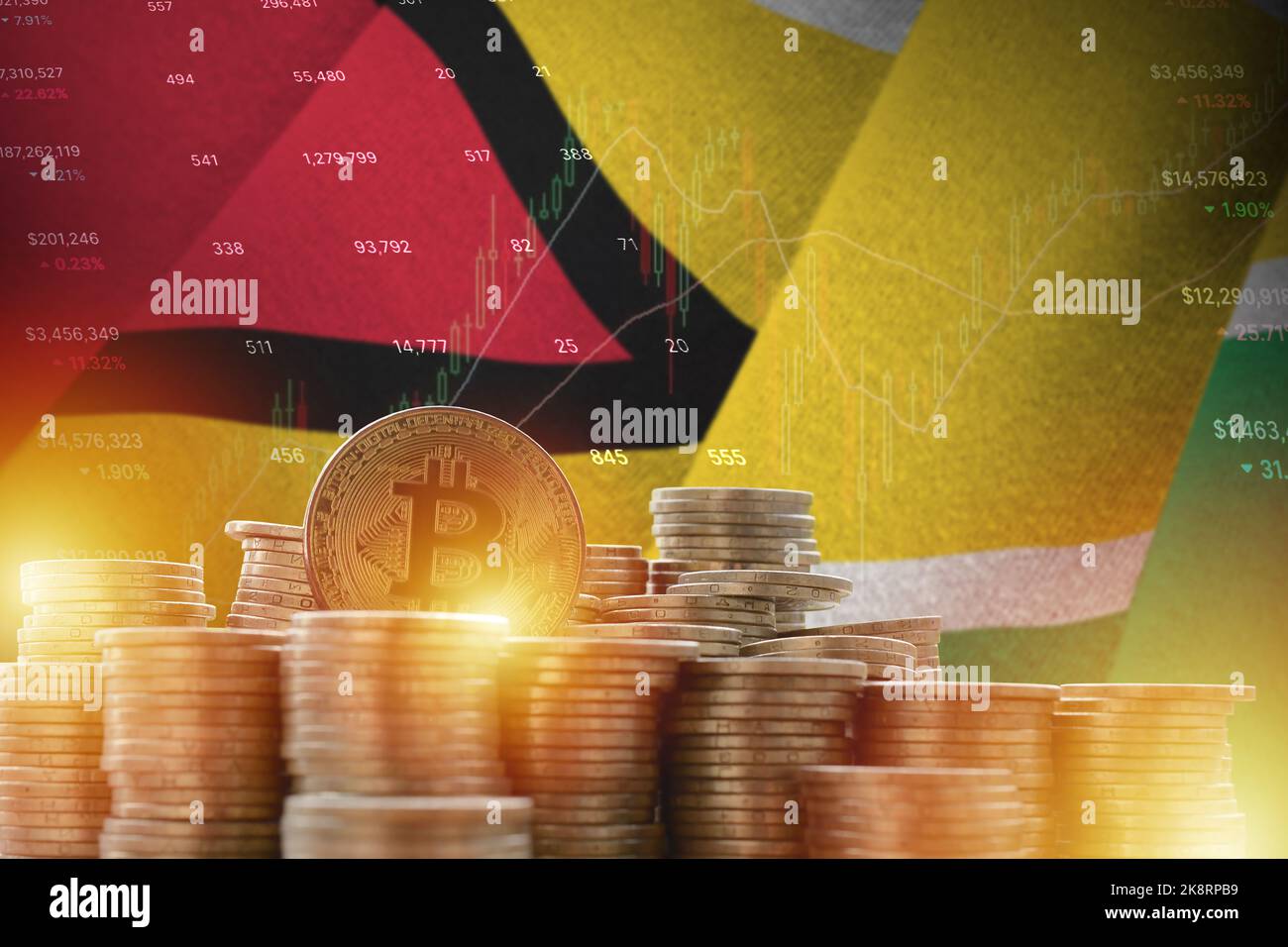 Guyana flag and big amount of golden bitcoin coins and trading platform ...