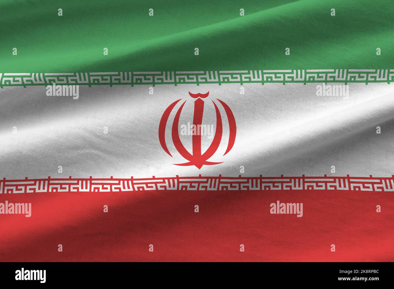Iran flag with big folds waving close up under the studio light indoors ...