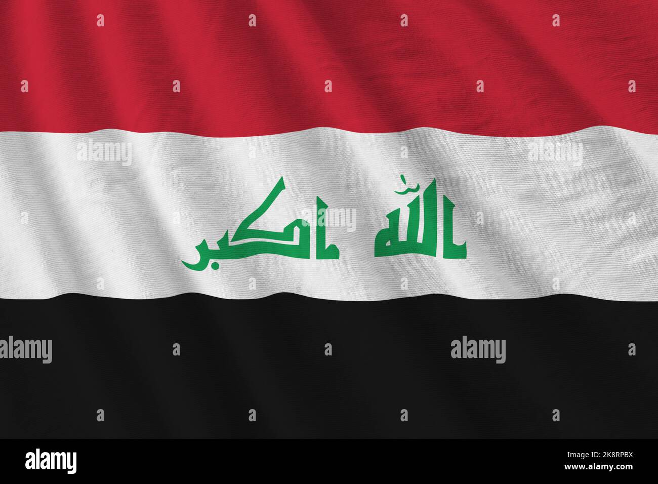 Iraq flag with big folds waving close up under the studio light indoors ...