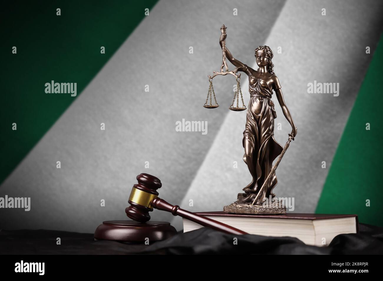 Nigeria flag with statue of lady justice, constitution and judge hammer ...