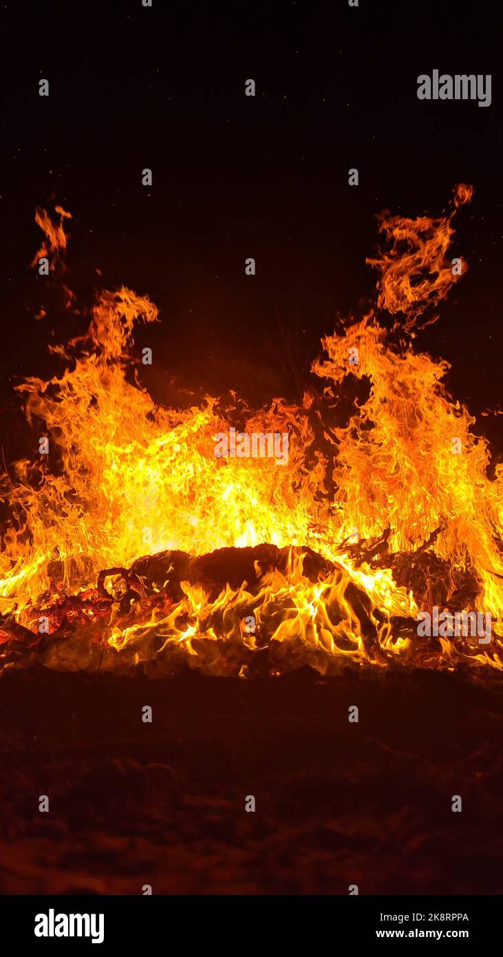 A vertical closeup shot of intense wildfire of wood - Bonfires of Saint ...