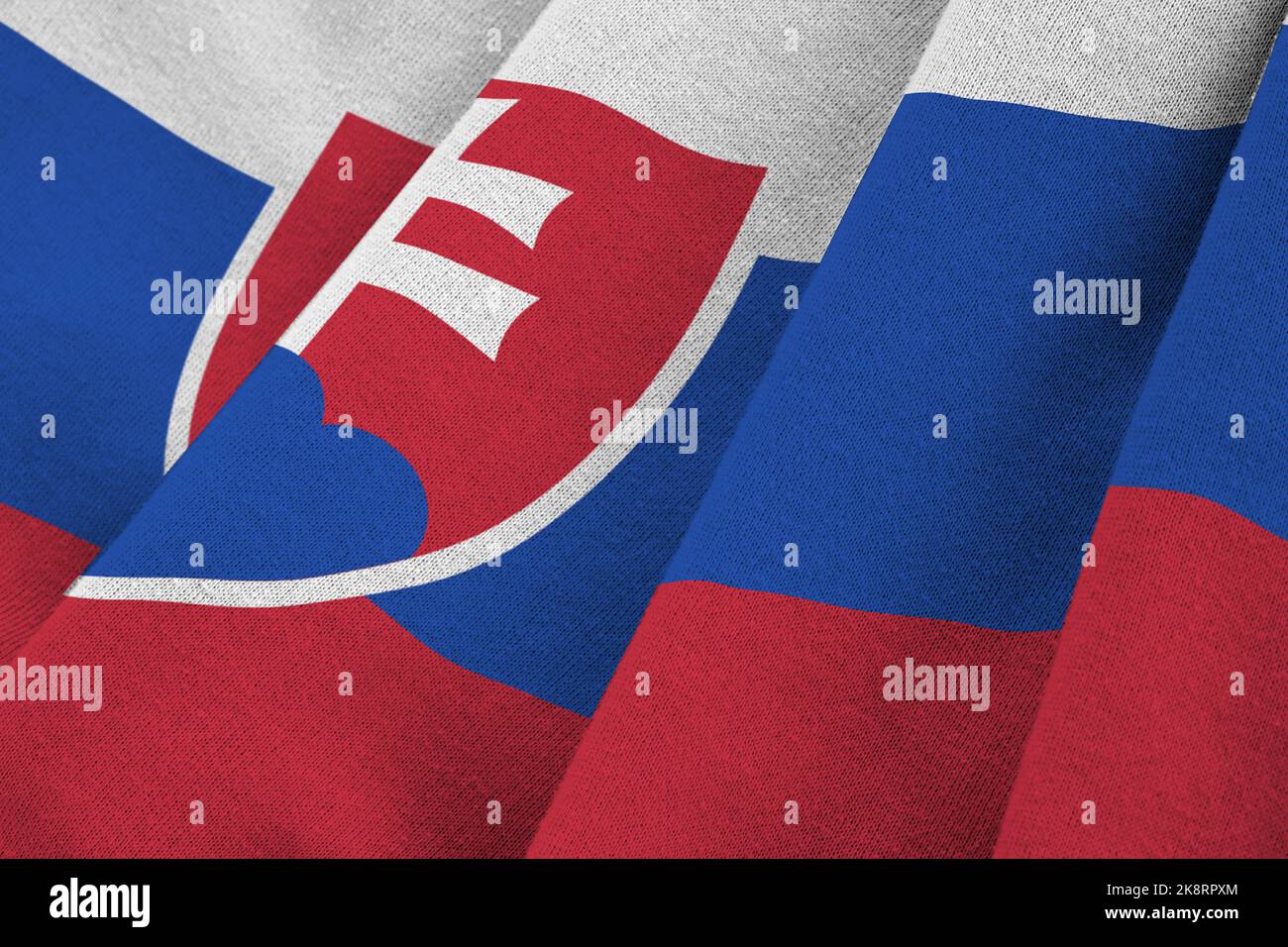 Slovakia flag with big folds waving close up under the studio light ...