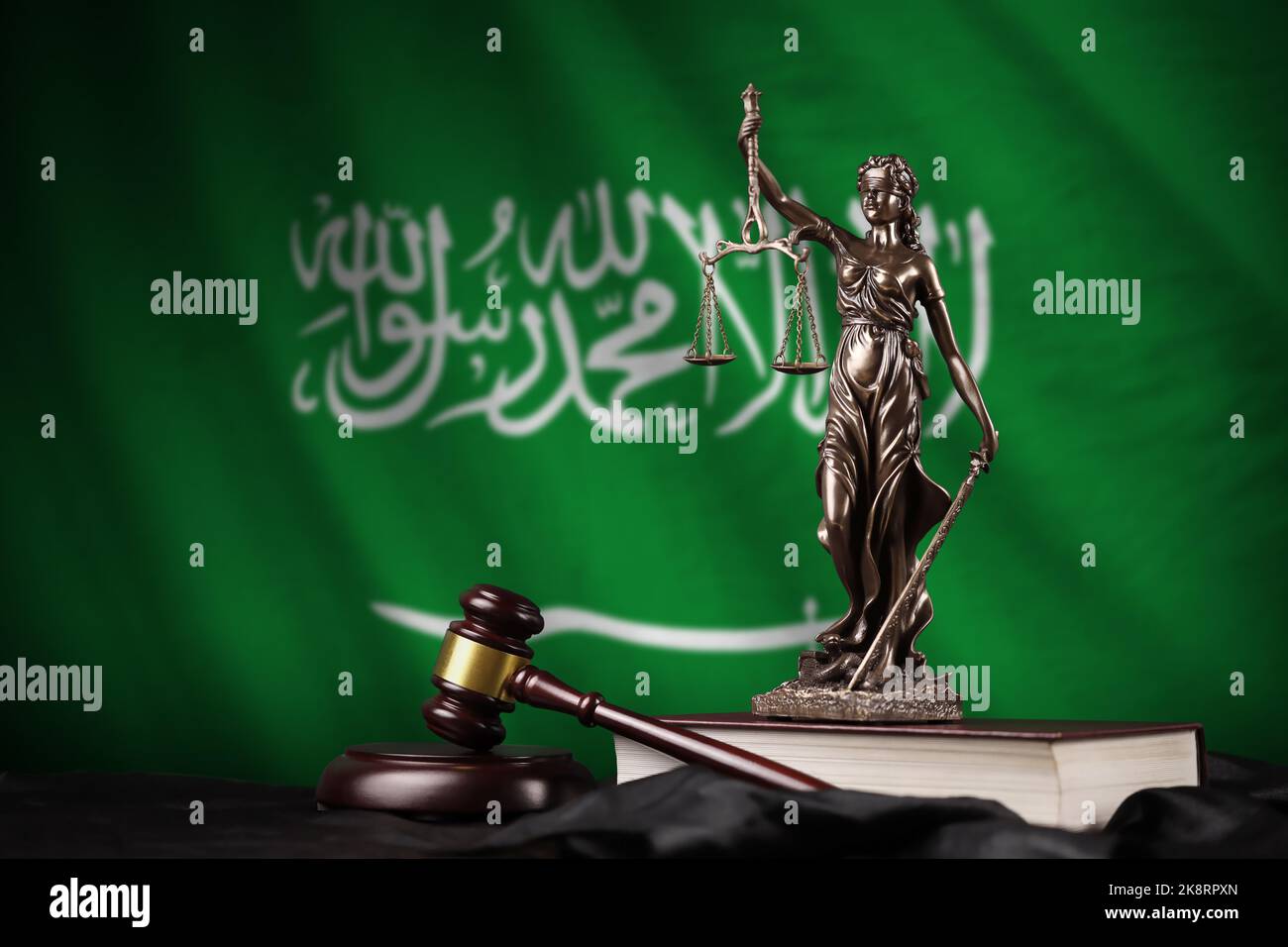 Saudi Arabia flag with statue of lady justice, constitution and judge ...