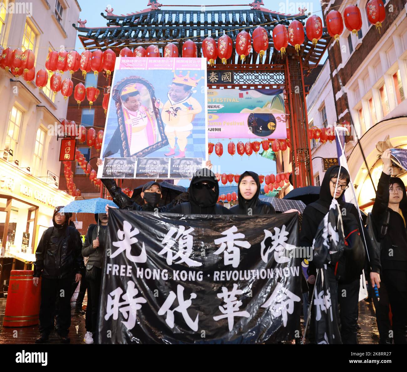 Protester arrives in Chinatown holding a Free Hong Kong Revolution Now ...