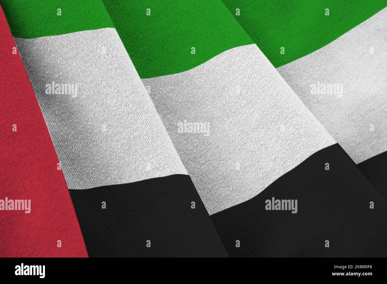 United Arab Emirates flag with big folds waving close up under the ...
