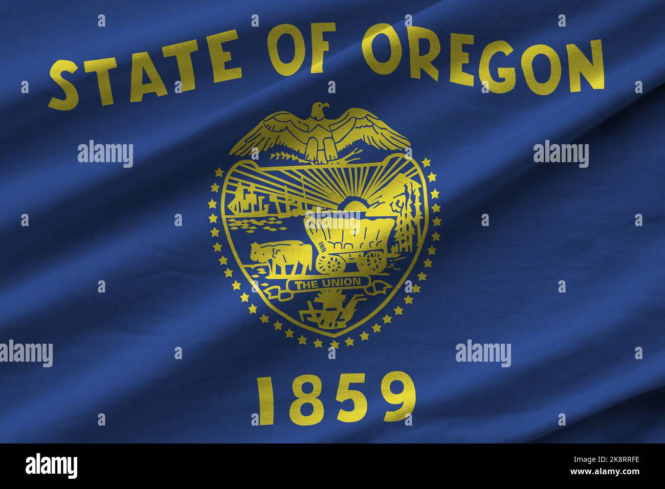 Oregon US state flag with big folds waving close up under the studio ...