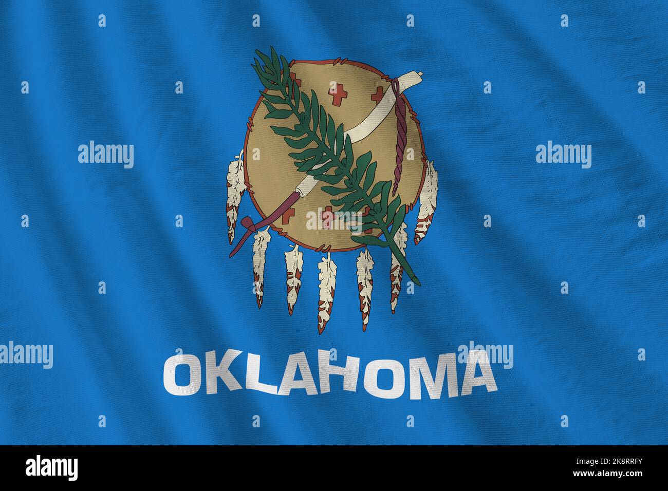Oklahoma US state flag with big folds waving close up under the studio ...