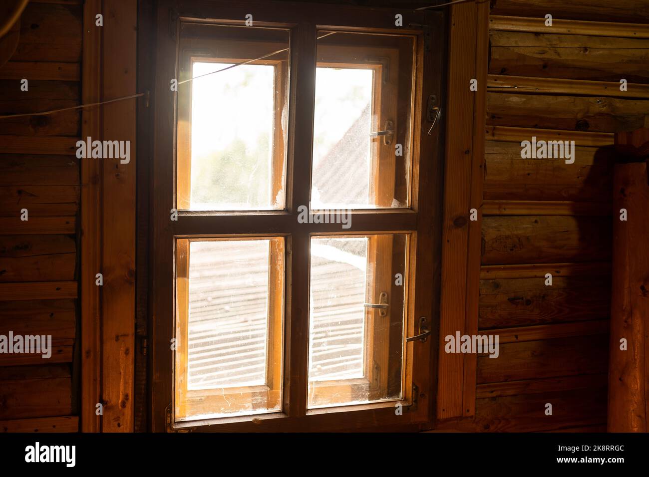 A wooden window in a wall made of logs with white background Stock ...