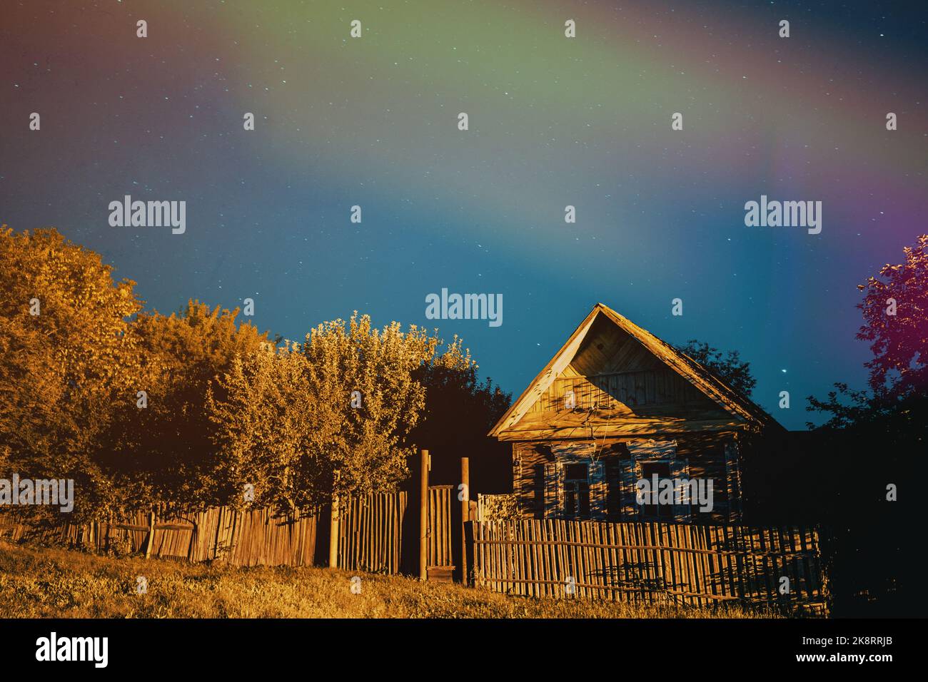 Night sky over house in old village. Night starry sky above house with ...