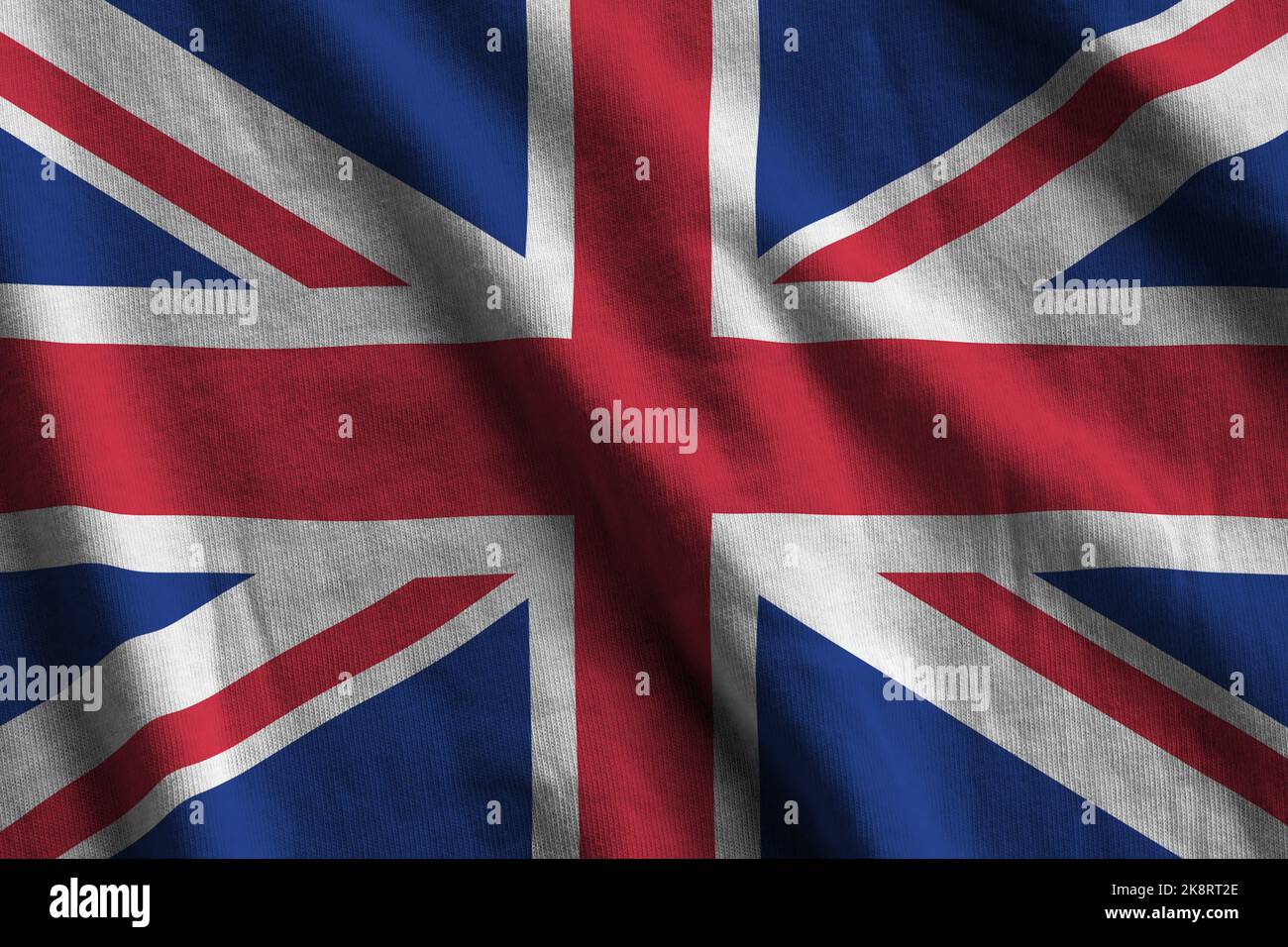 Great britain flag with big folds waving close up under the studio ...