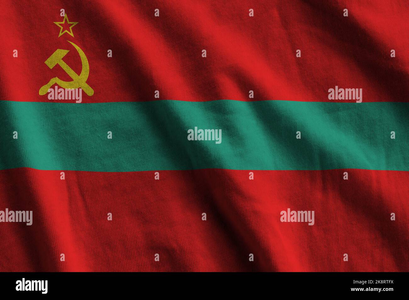 Transnistria flag with big folds waving close up under the studio light ...