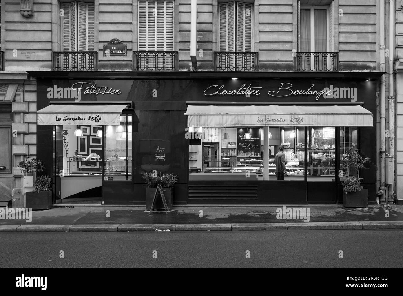 A grayscale of a bakery in Paris in early the morning, France Stock ...