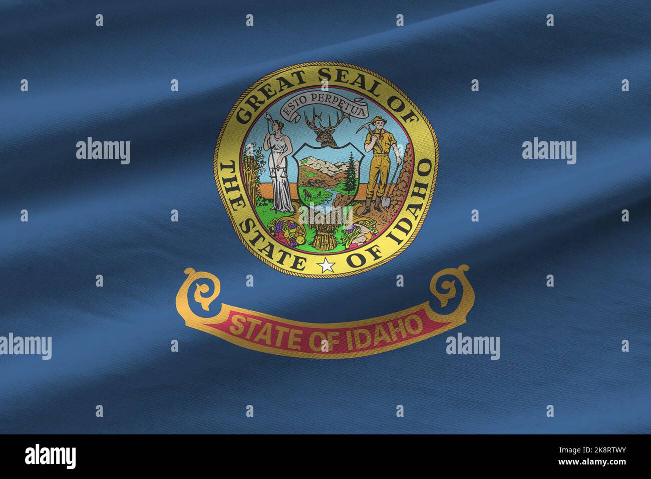 Idaho US state flag with big folds waving close up under the studio ...