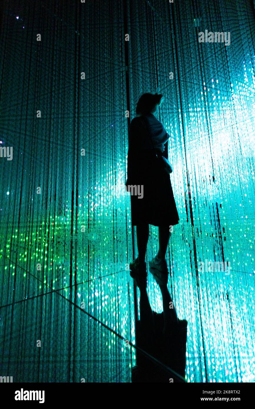 Woman and other people in illuminated virtual multiverse concept Stock ...