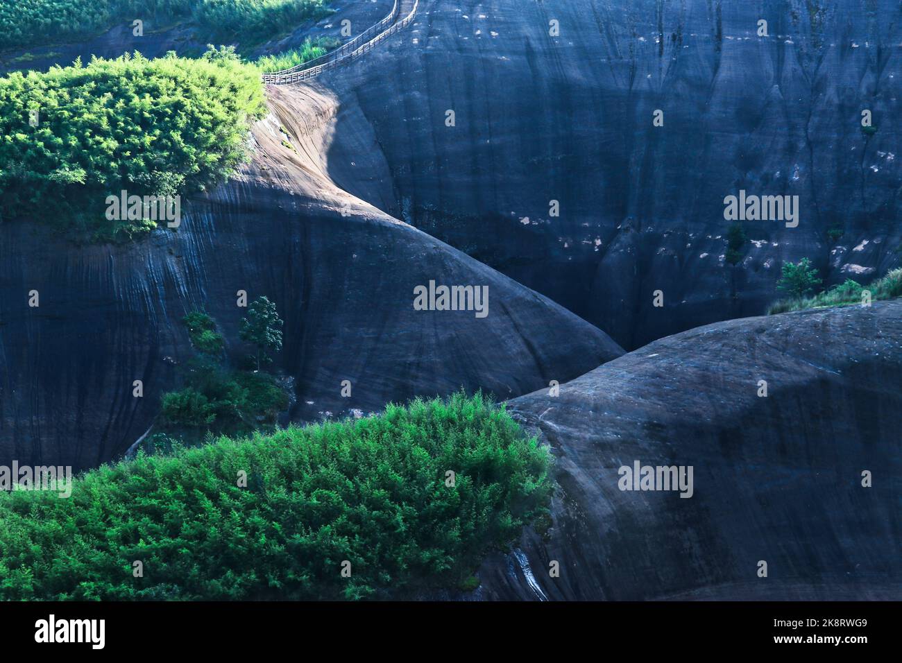An aerial view of scenic rocky Gaoyi Ridge with scattered green ...