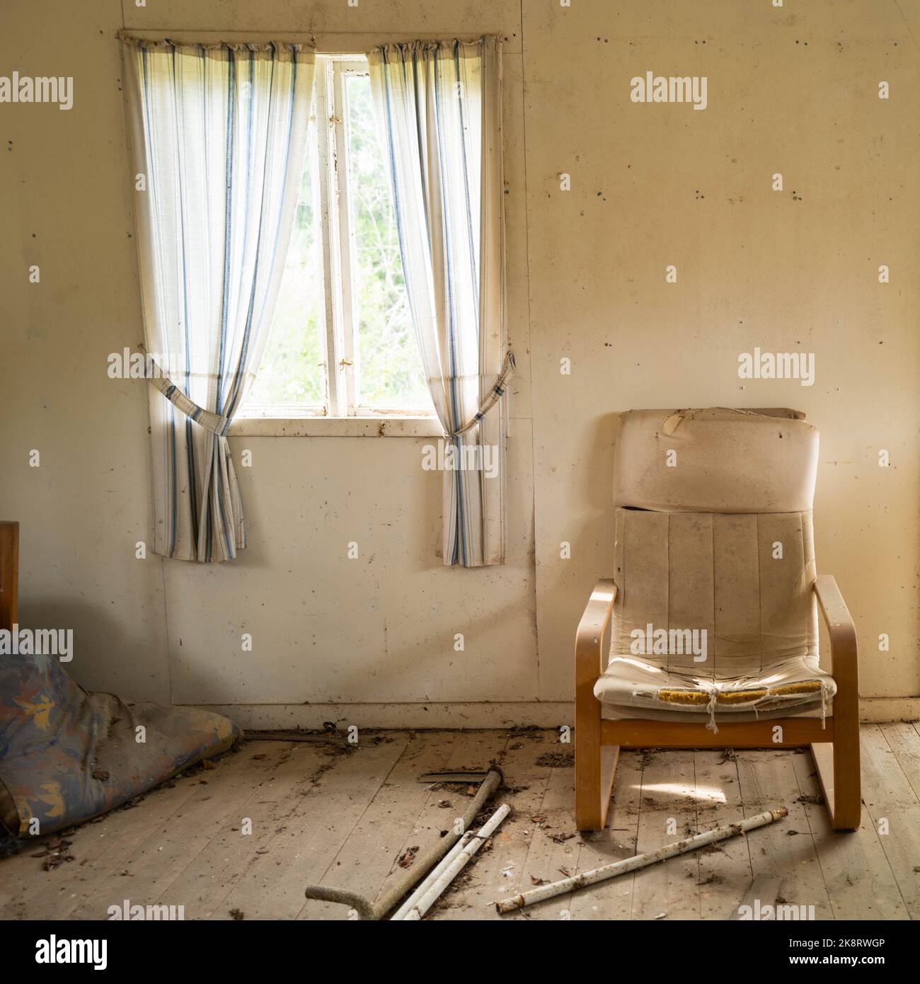 An old abandoned dirty room with aged armchair, floor and window Stock ...